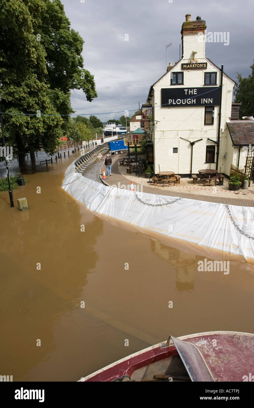 Flood barriers alongside flooded River Severn in spate June 27 2007 ...