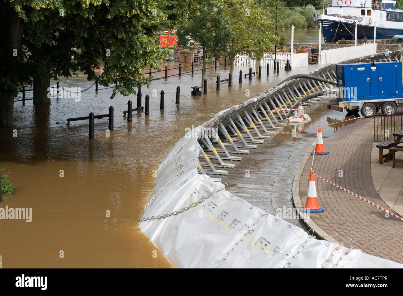Flood barriers alongside flooded River Severn in spate June 27 2007 ...