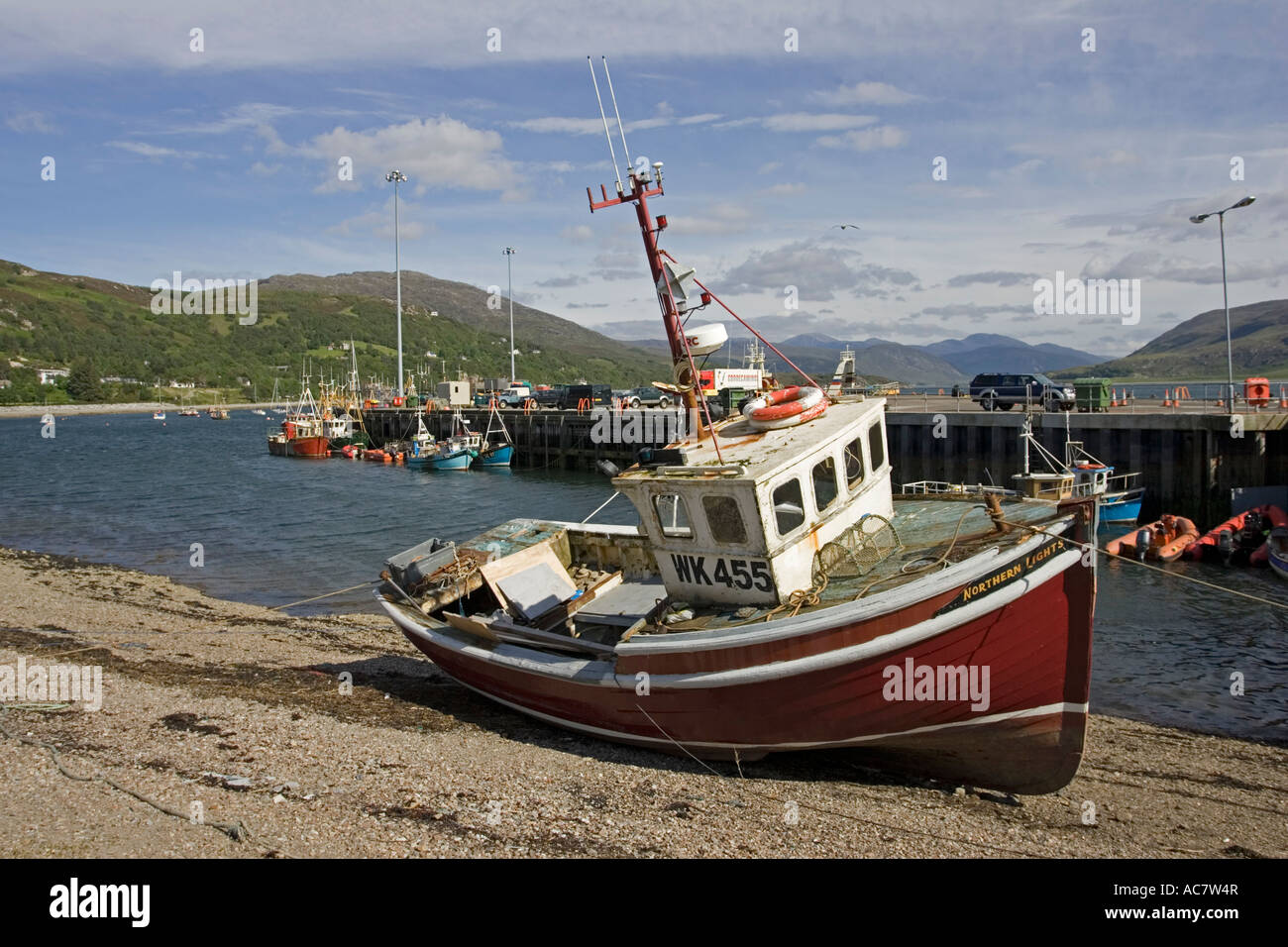 Trawlers in harbour fishing port and coastal town of Ullapool North ...