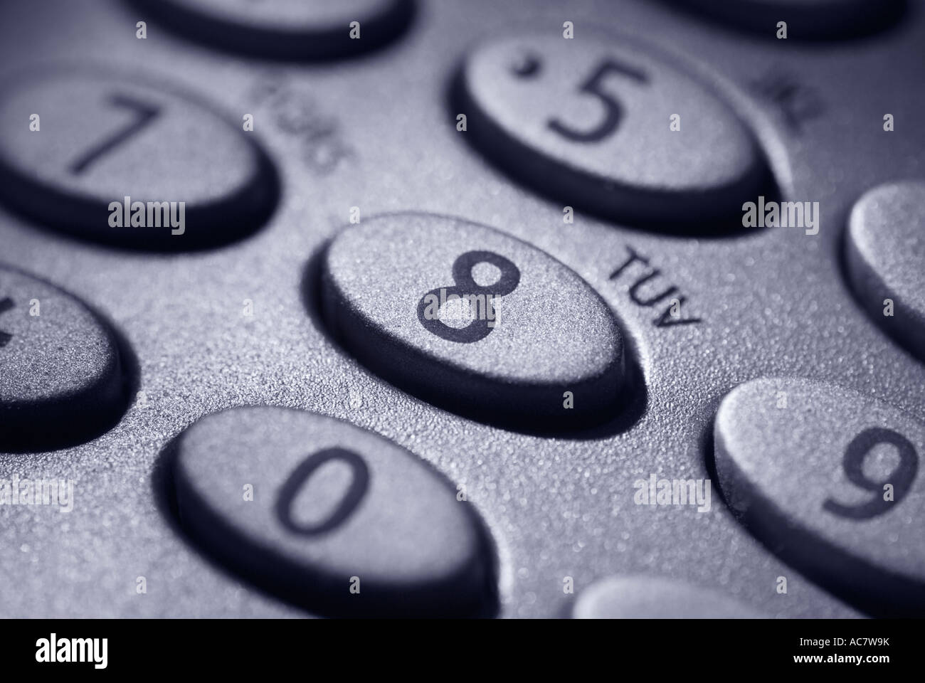 A close up of a keypad on a modern telephone. Selective focus on the ...
