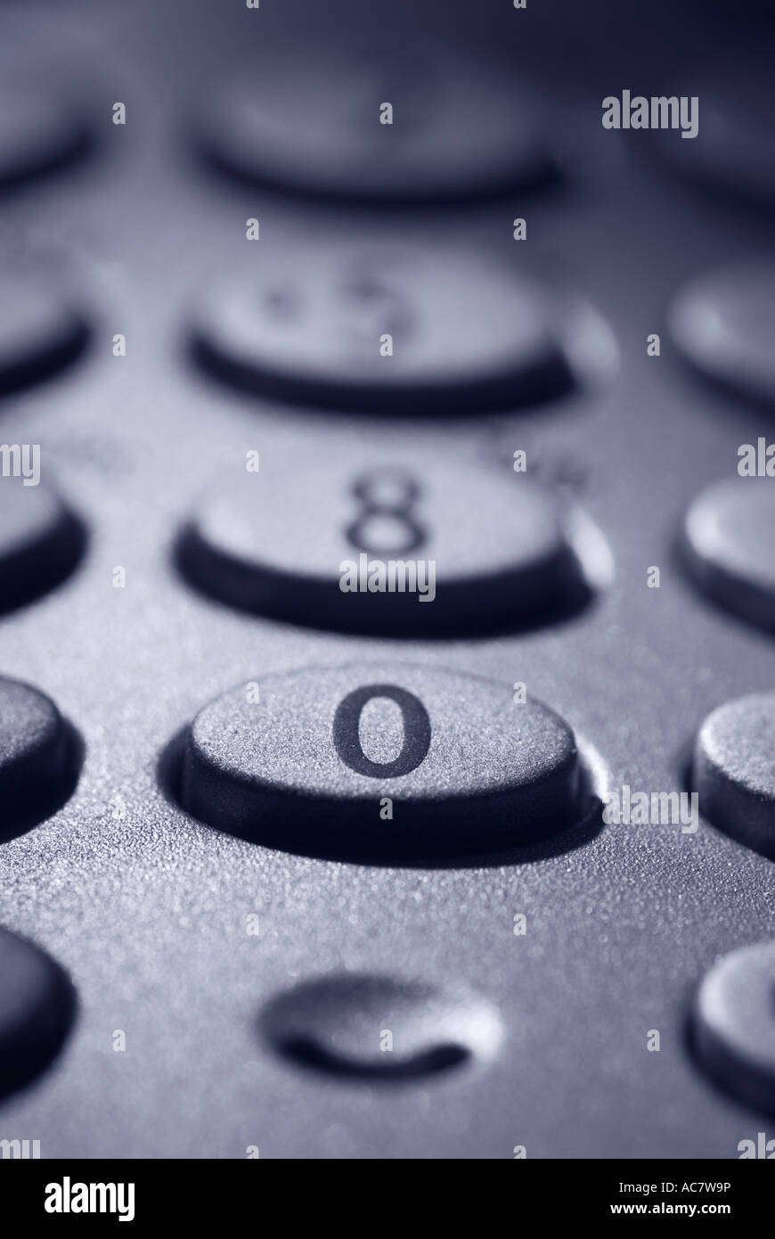 A close up of a keypad on a modern telephone. Selective focus on the ...