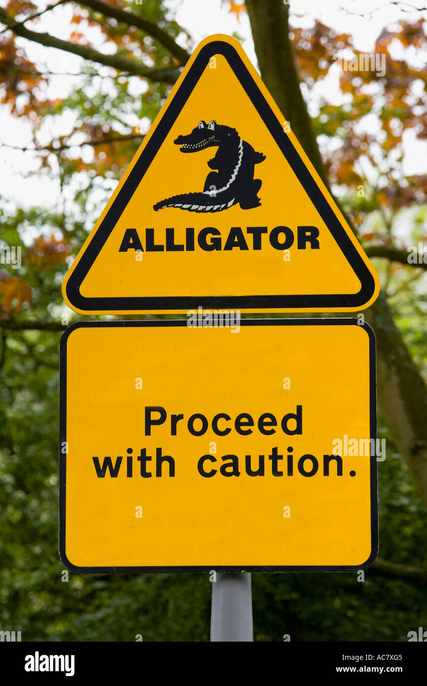 A sign warning of dangerous alligator Stock Photo - Alamy