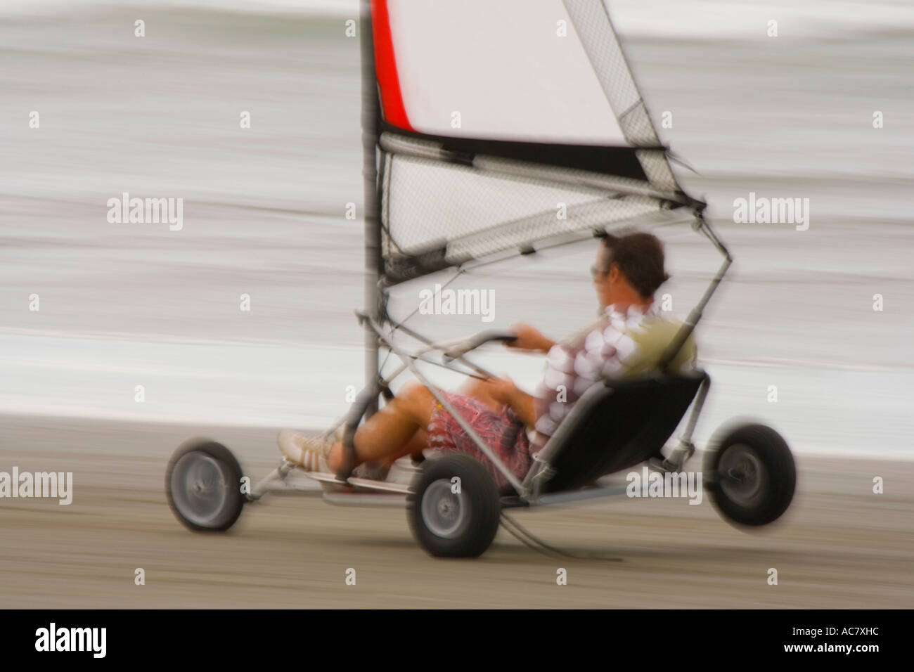 Motion blurred shot of a land yacht racing at speed down a beach Stock ...