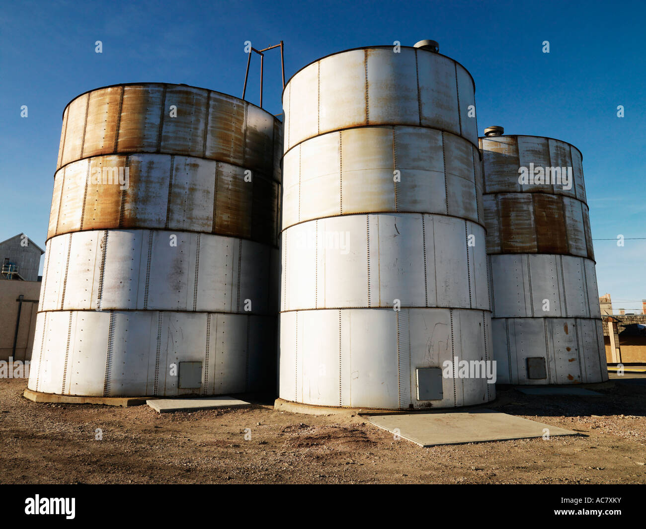 Three silos in rural setting Stock Photo - Alamy