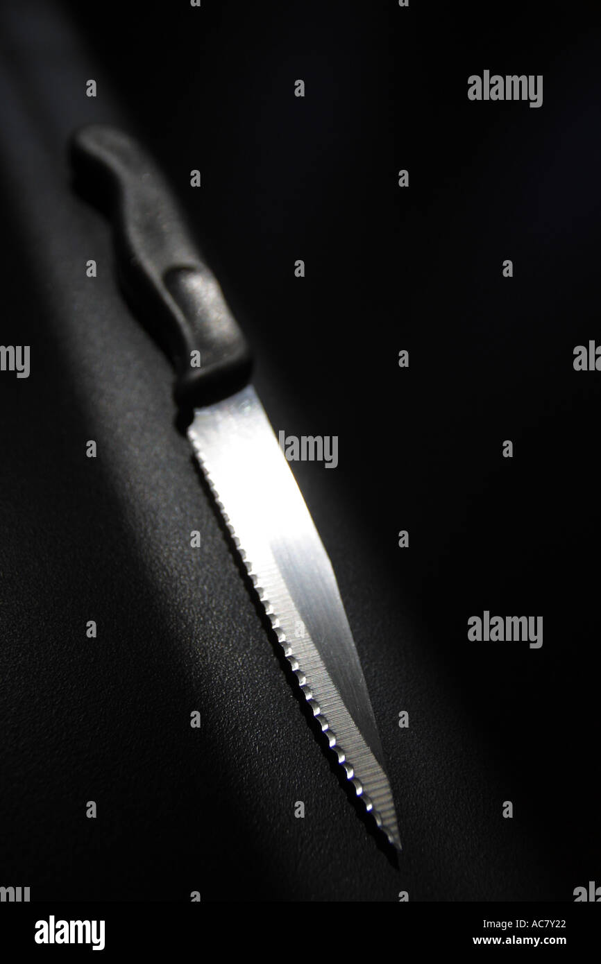 Sharp kitchen knife on black background with spotlight Stock Photo - Alamy