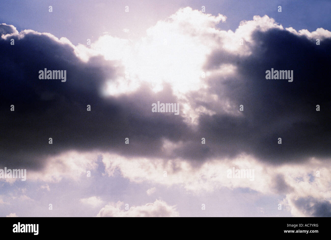 Sun breaking through rain clouds over Suffolk, UK Stock Photo - Alamy