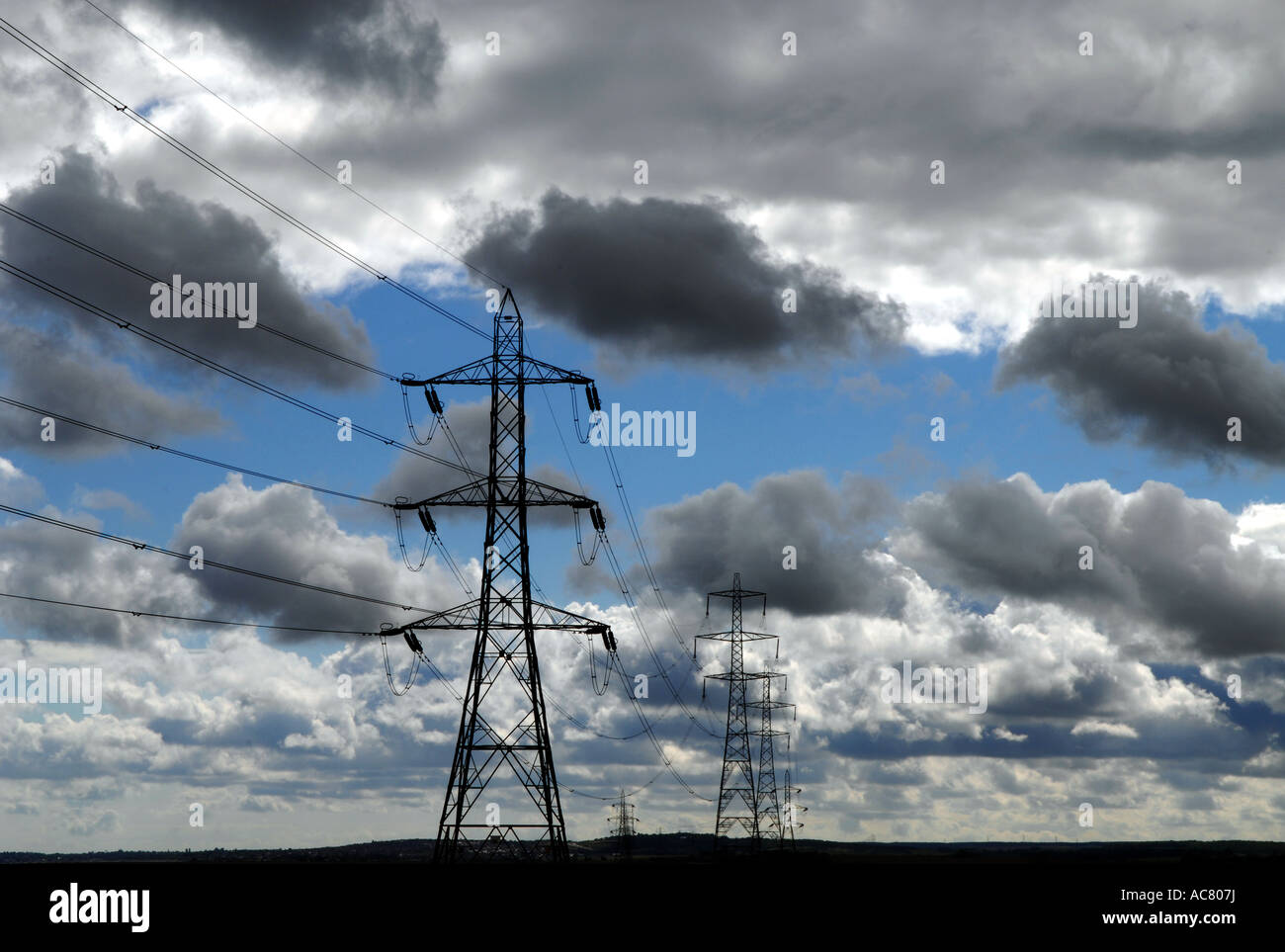 Dramatic electricity pylons hi-res stock photography and images - Alamy
