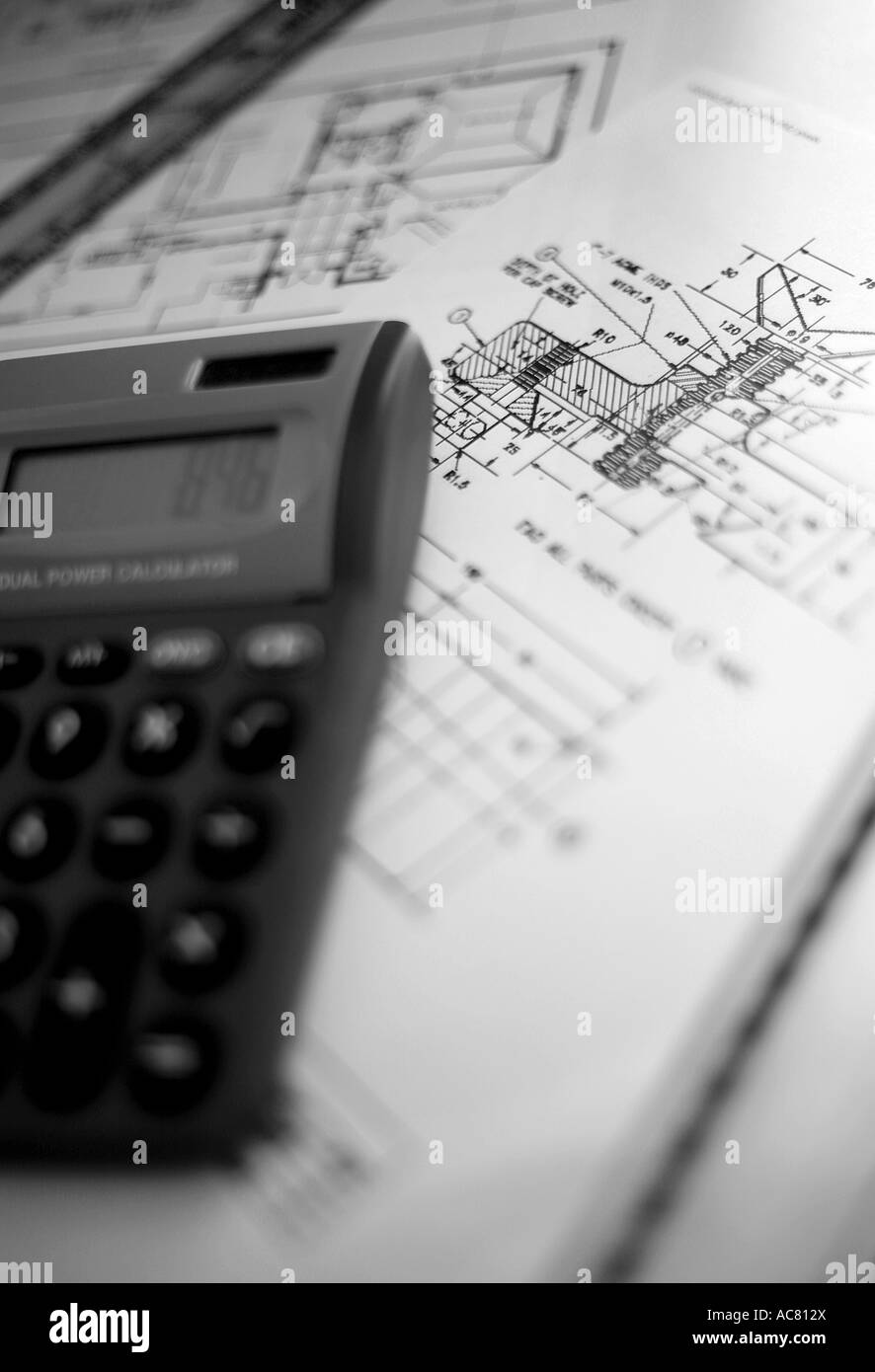 Calculator on architectural drawings, black and white, vertical Stock ...