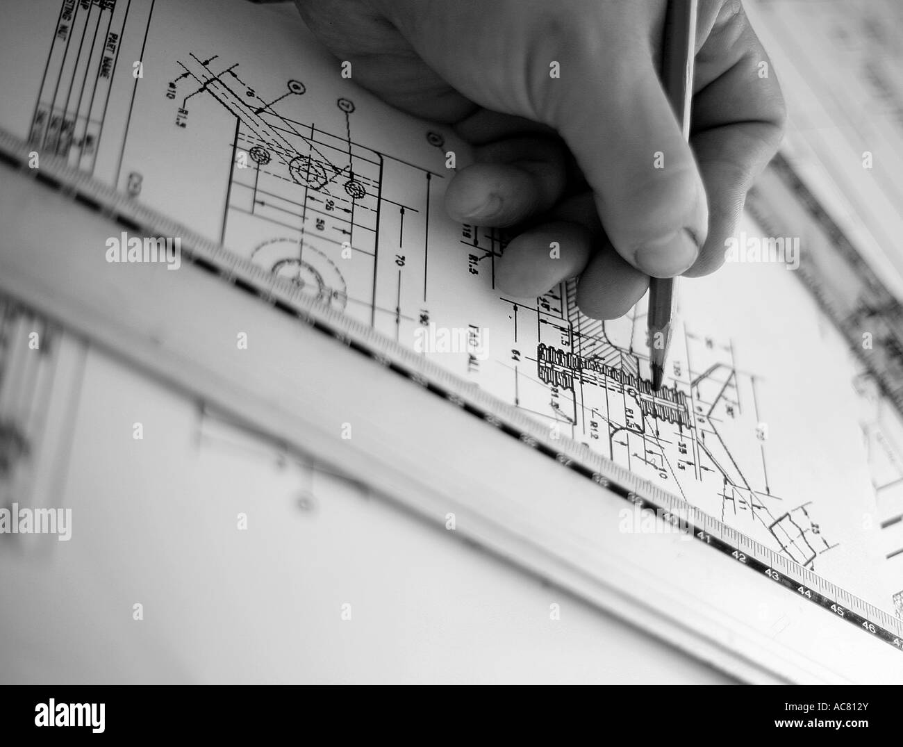 Hand amending architectural drawings Stock Photo - Alamy