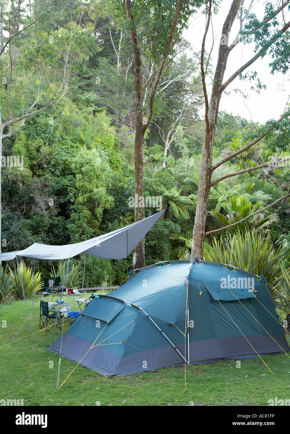 family camping in the bush with large family tent and tarp Stock Photo ...