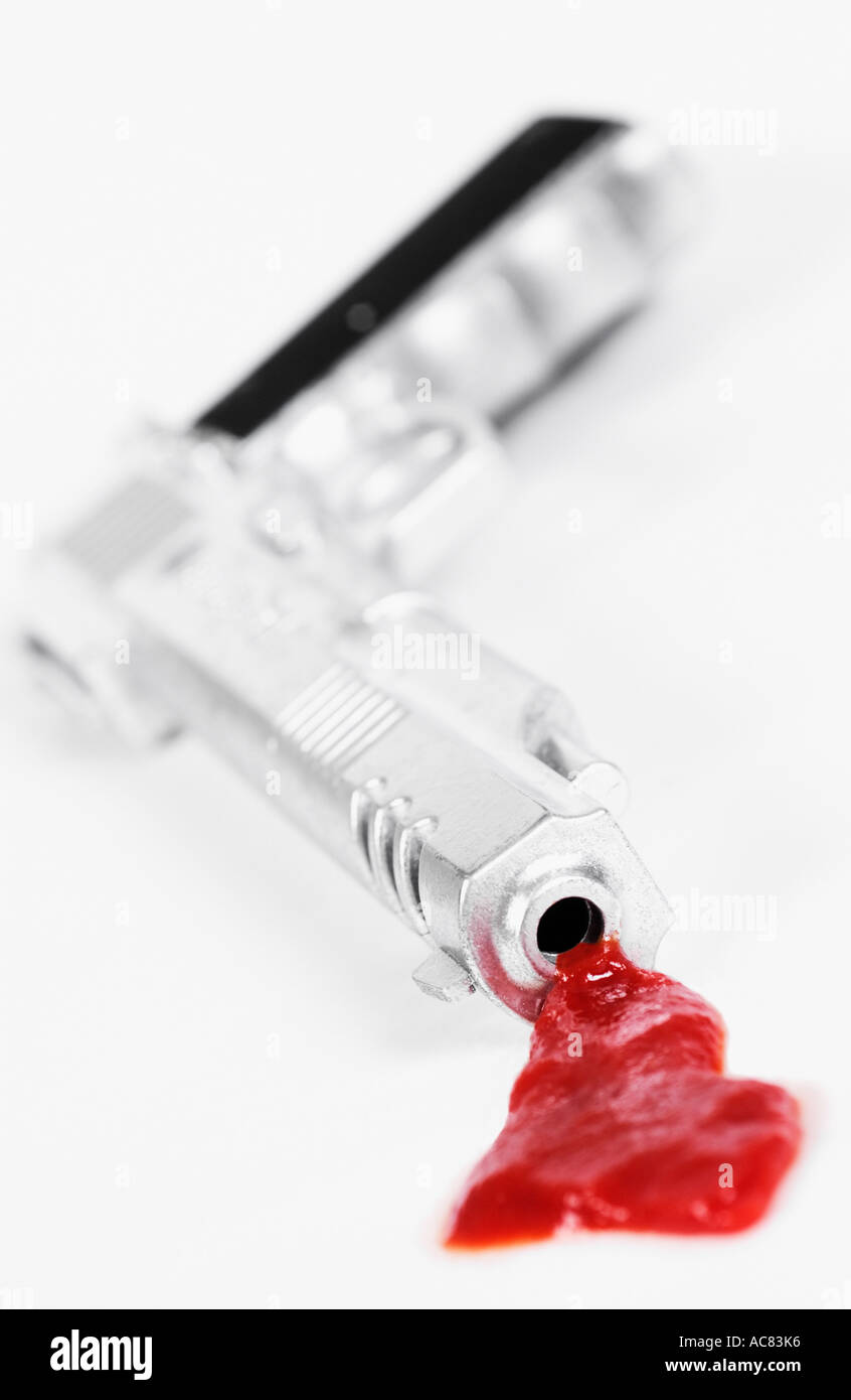 silver pistol with leaking blood Stock Photo - Alamy
