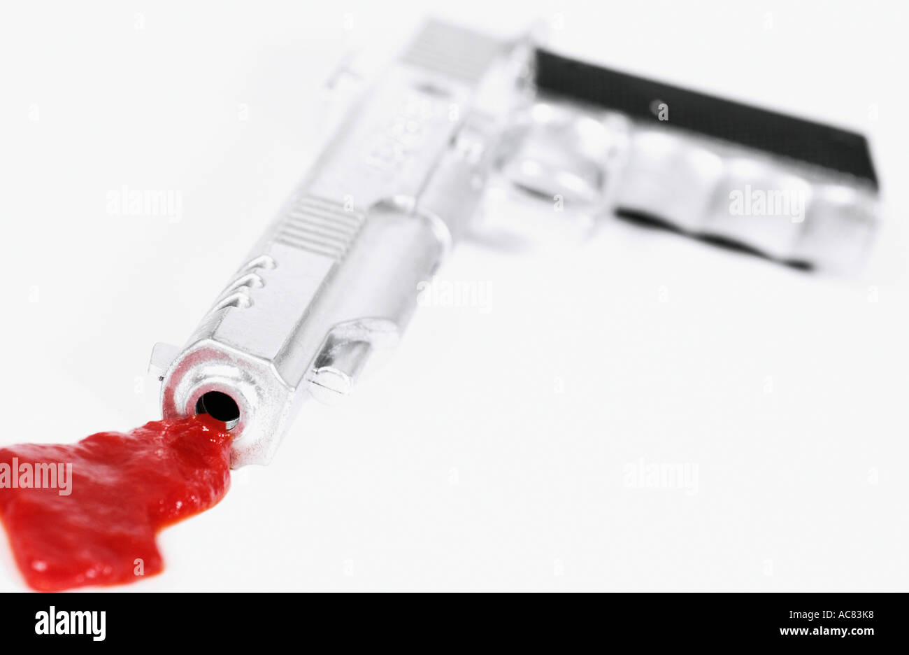 silver pistol with leaking blood Stock Photo - Alamy