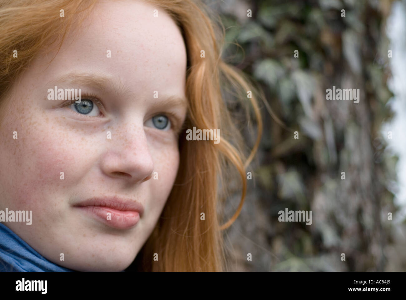 Close Up Portrait Of A 13 Year Old Girl With Red Hair And Freckles