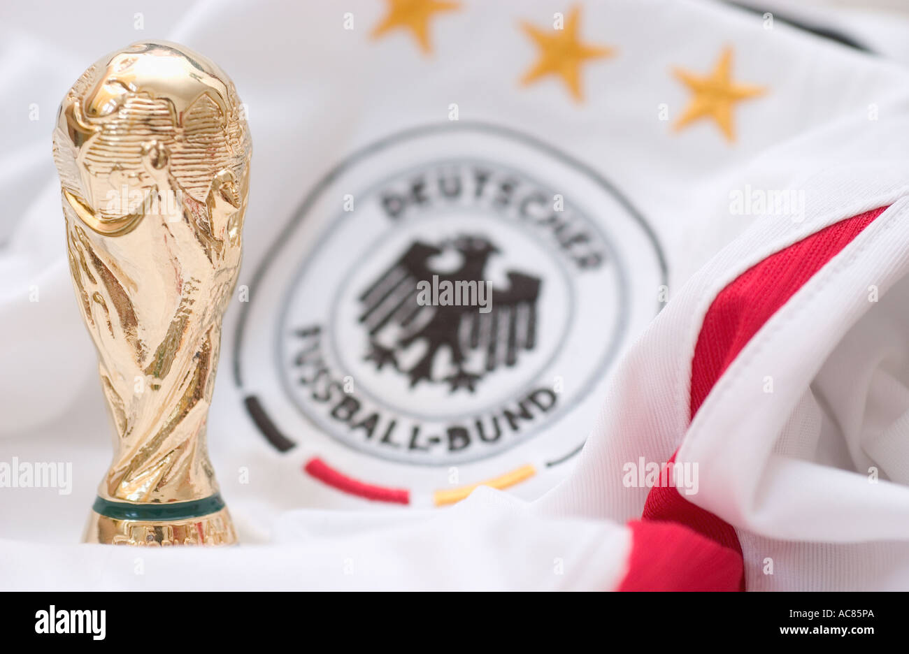 miniature copy of the soccer world cup trophy on the tricot of the ...
