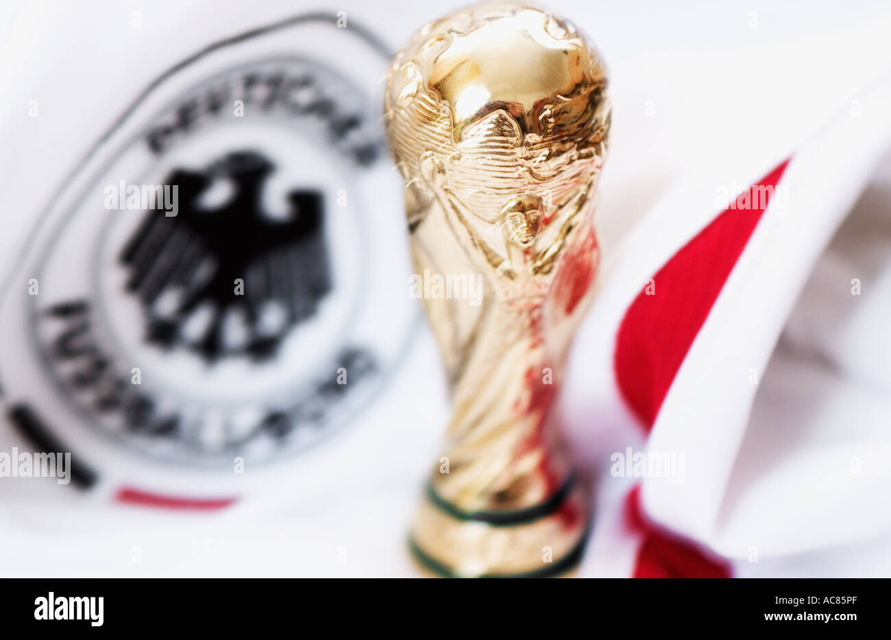 miniature copy of the soccer world cup trophy on the tricot of the ...