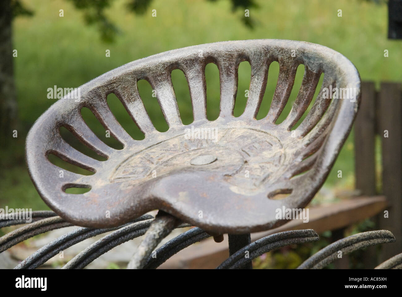 Old Fashioned Farmer's Tractor seat Stock Photo - Alamy