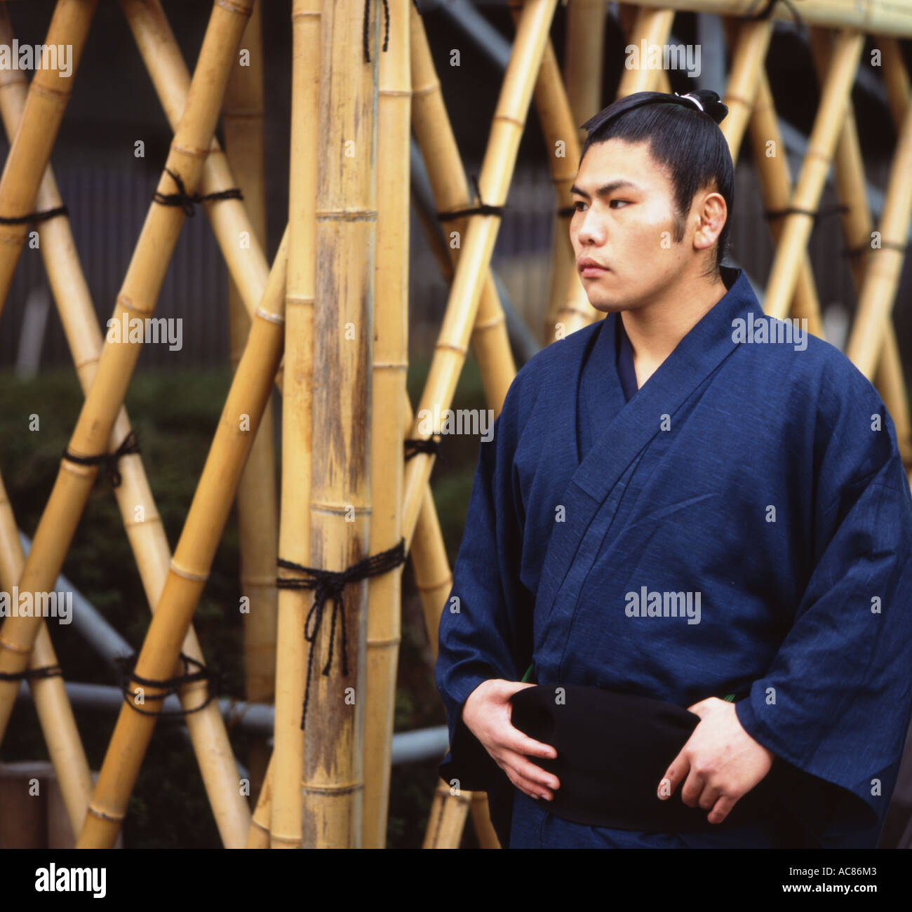 Sumo wrestler in kimono stands outside the Osaka Basho 2006 Stock Photo ...