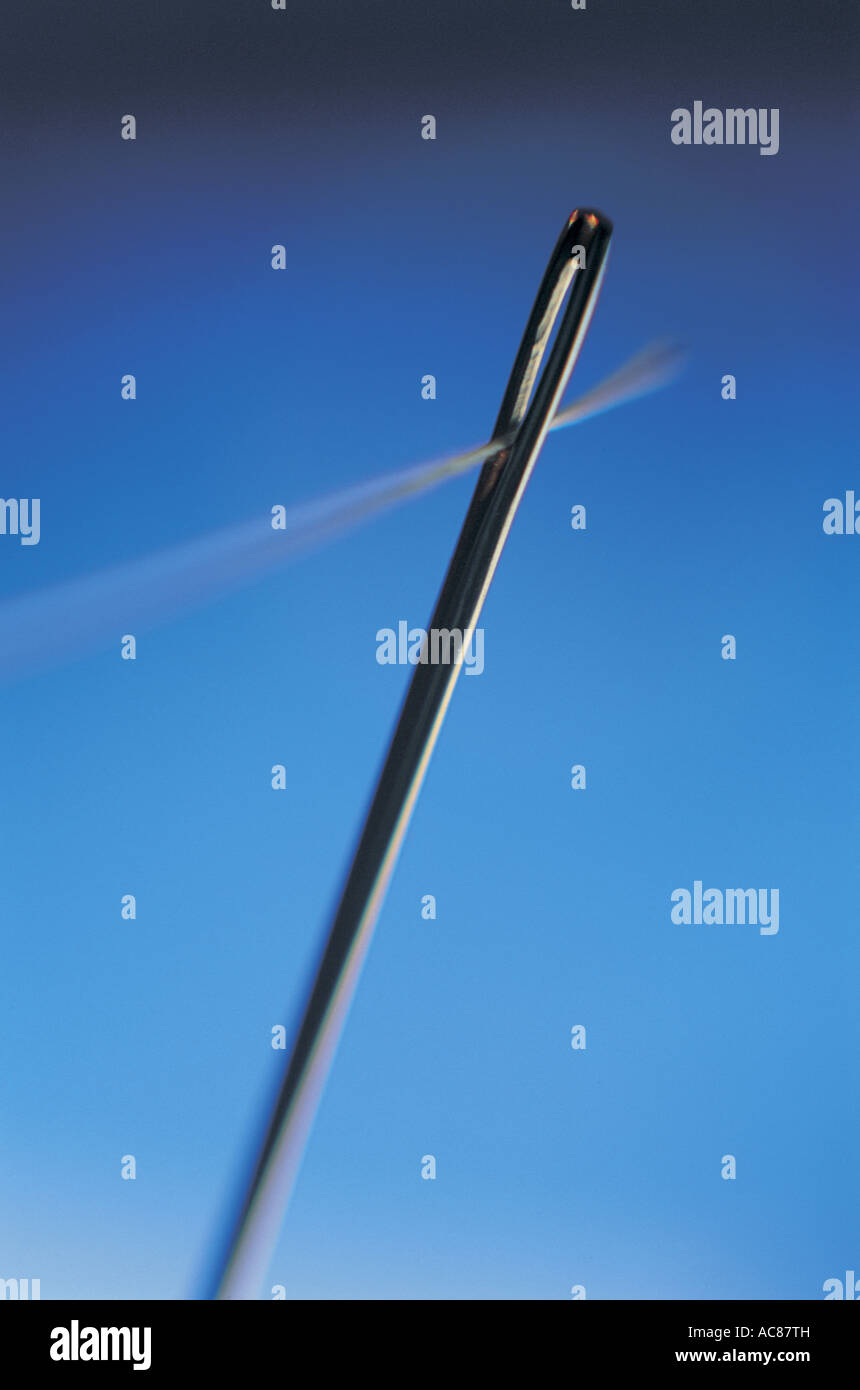 Threading a needle Stock Photo - Alamy