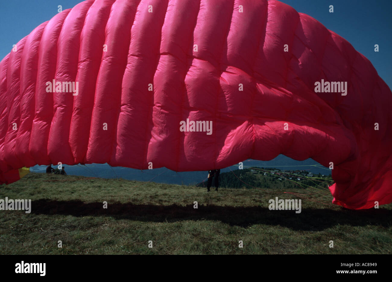 Paragliding in red Stock Photo - Alamy