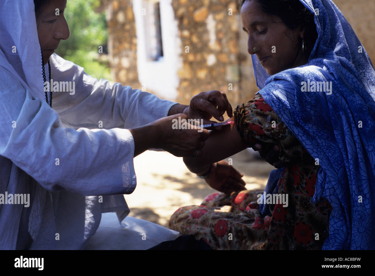 Pakistan Northwest Frontier Province Female doctor vaccinates woman for ...