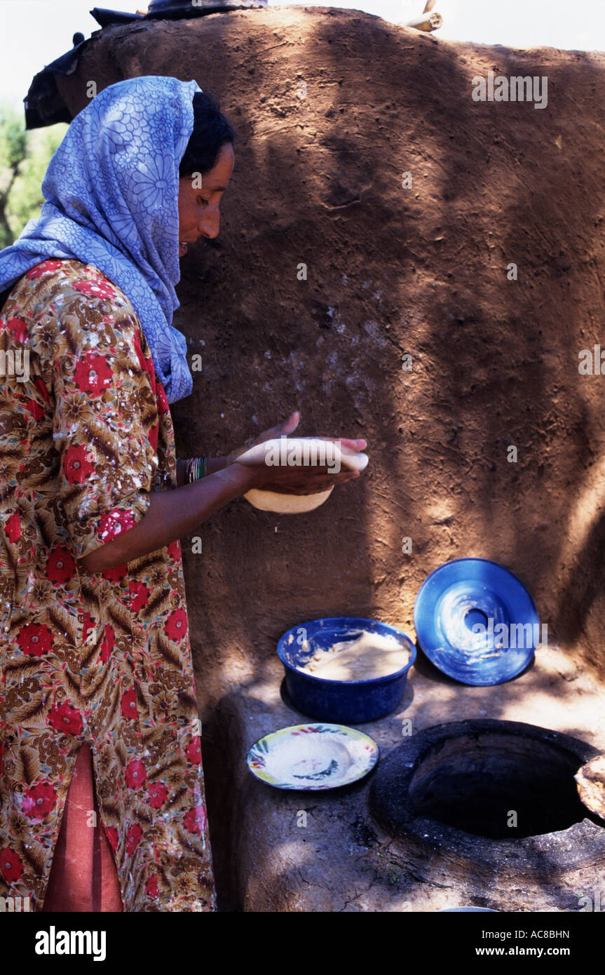 Pakistan Northwest Frontier Province Young woman cooks chapati on ...