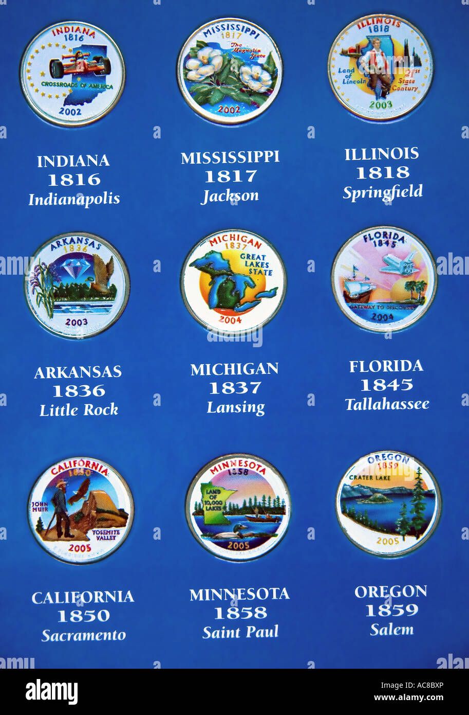 A close-up view of 9 colorized commemorative U.S. state coins, minted ...