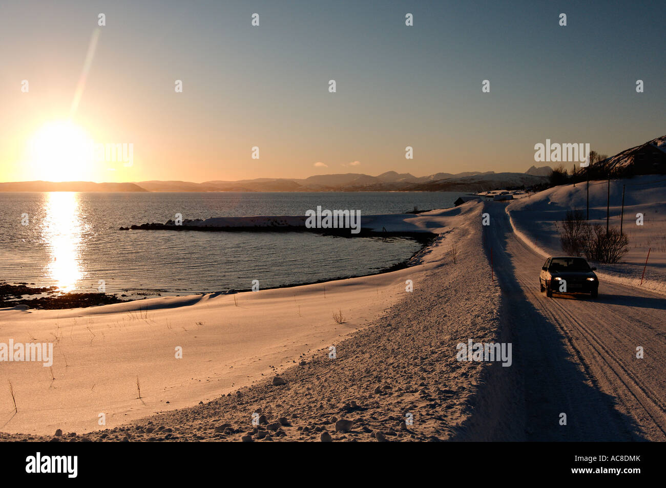 Typical fjord at sunset in northern Norway near Tromso in the winter ...