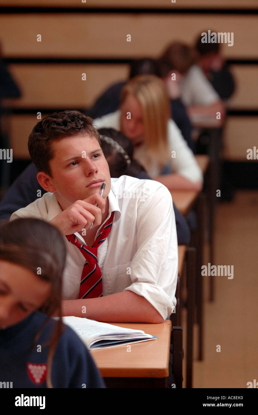 School pupils in an exam situation, in a school hall Stock Photo - Alamy