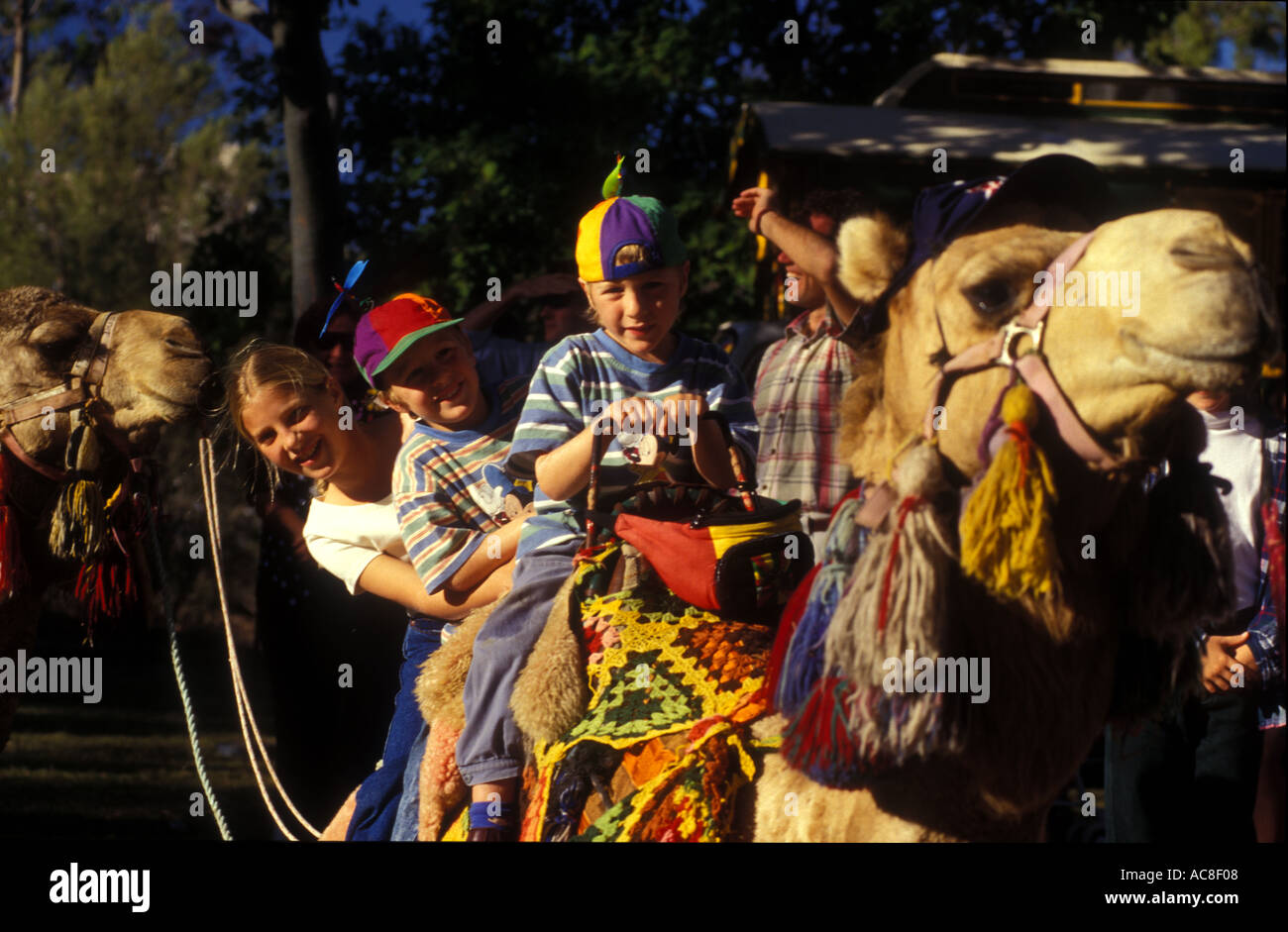 Kids children ride camel local hi-res stock photography and images - Alamy