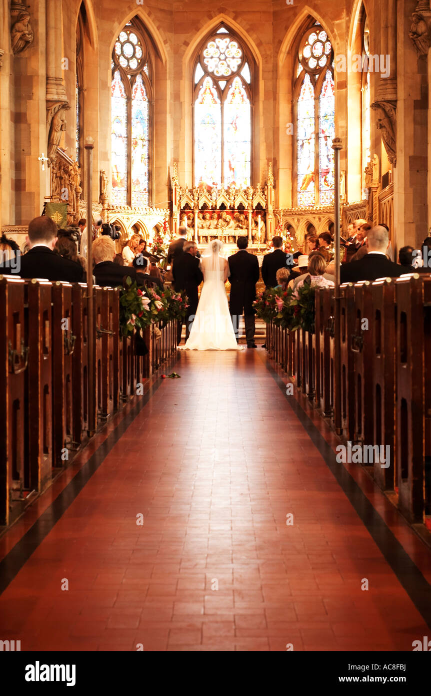 Bride and groom at the altar looking down the aisle Stock Photo - Alamy