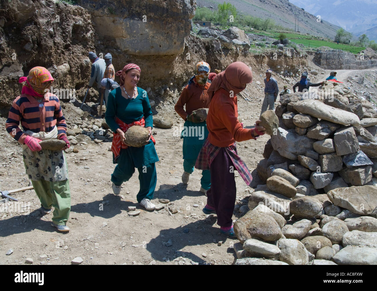 India Himachal Pradesh Spiti Pin valley Mud local women carrying heavy ...