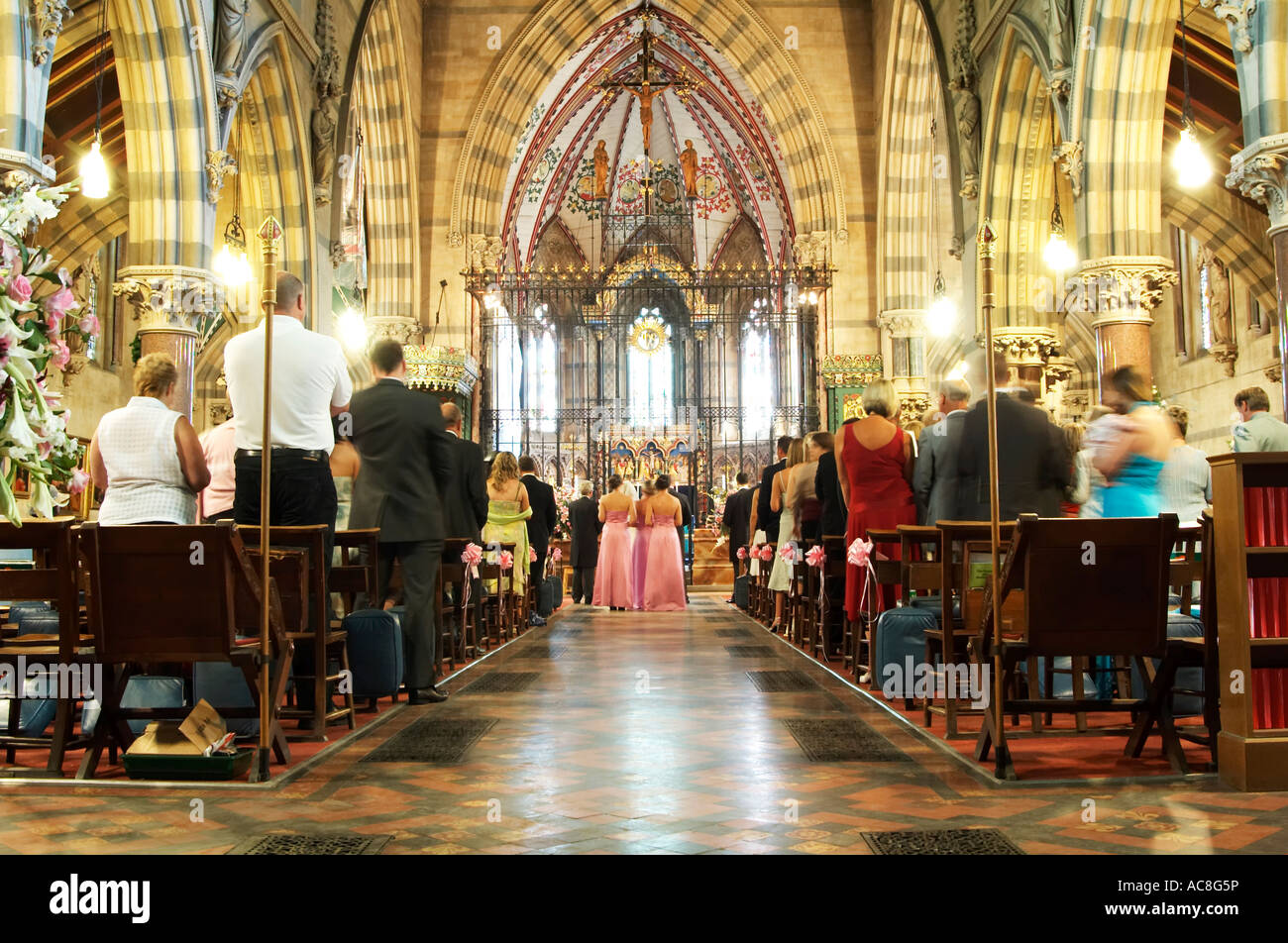 Bride and Groom at the altar Stock Photo - Alamy