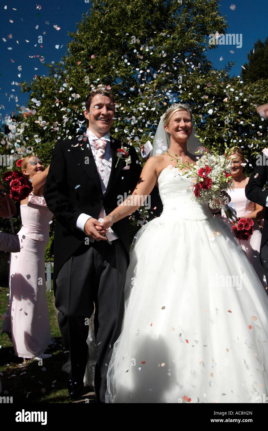 Bride and Groom with confetti being thrown over them Stock Photo - Alamy