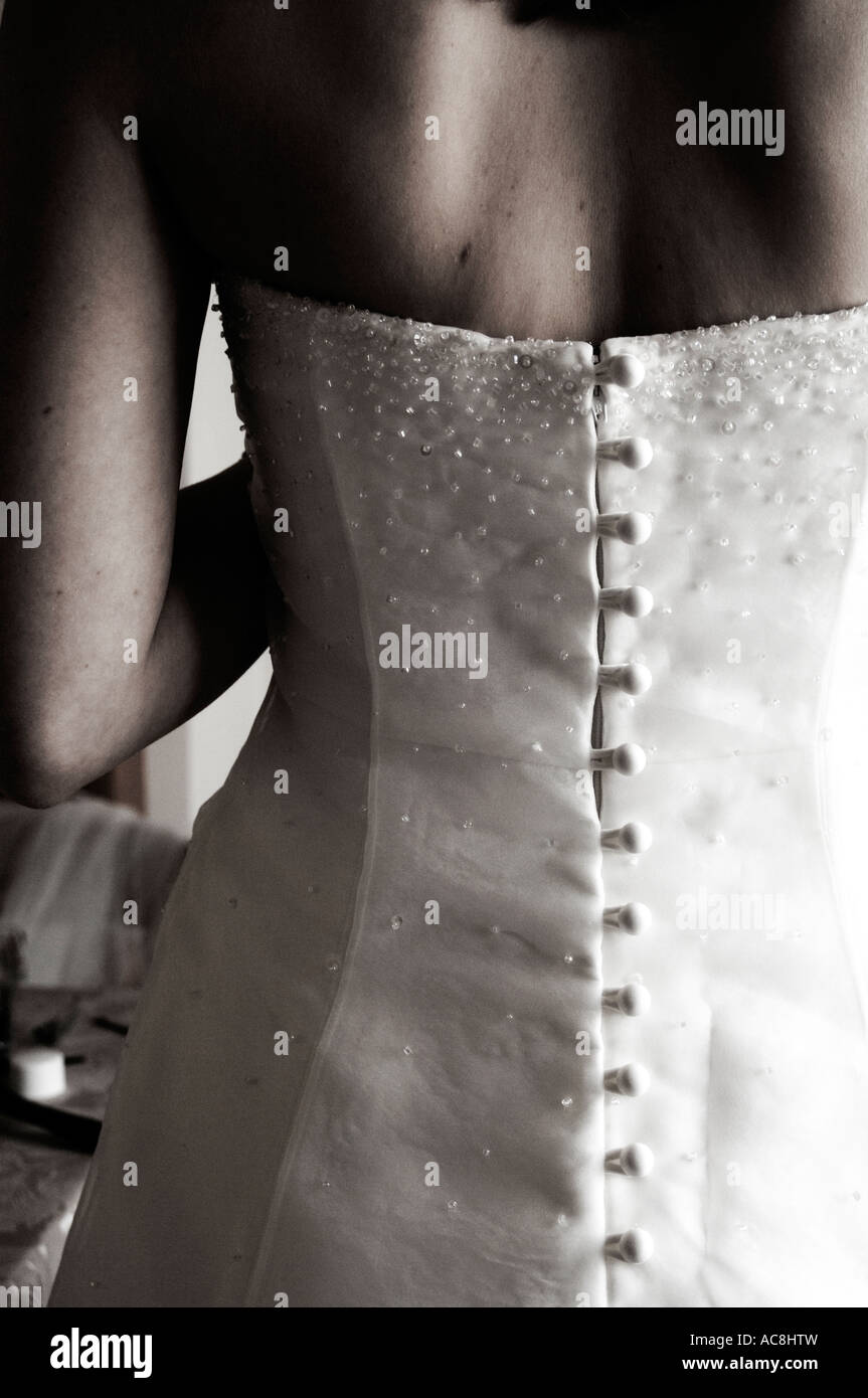 Back of dress and bride on her wedding day Stock Photo - Alamy