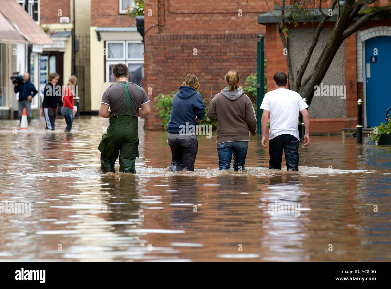 People wading through the floods hi-res stock photography and images ...