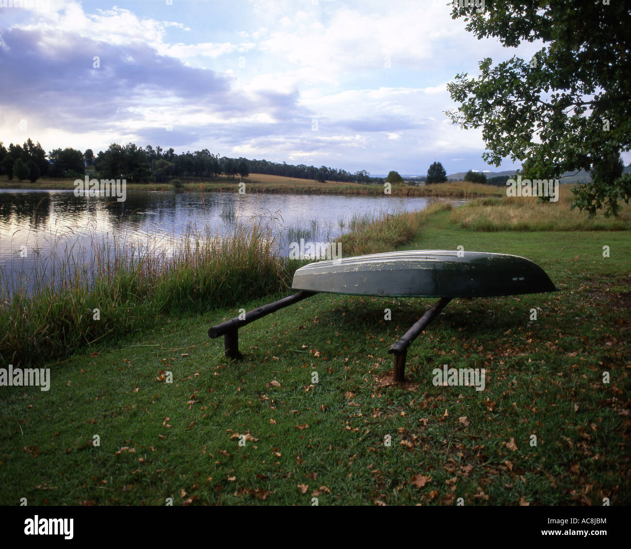 A boat on the banks of a dam in Himeville Nature Reserve Himeville ...