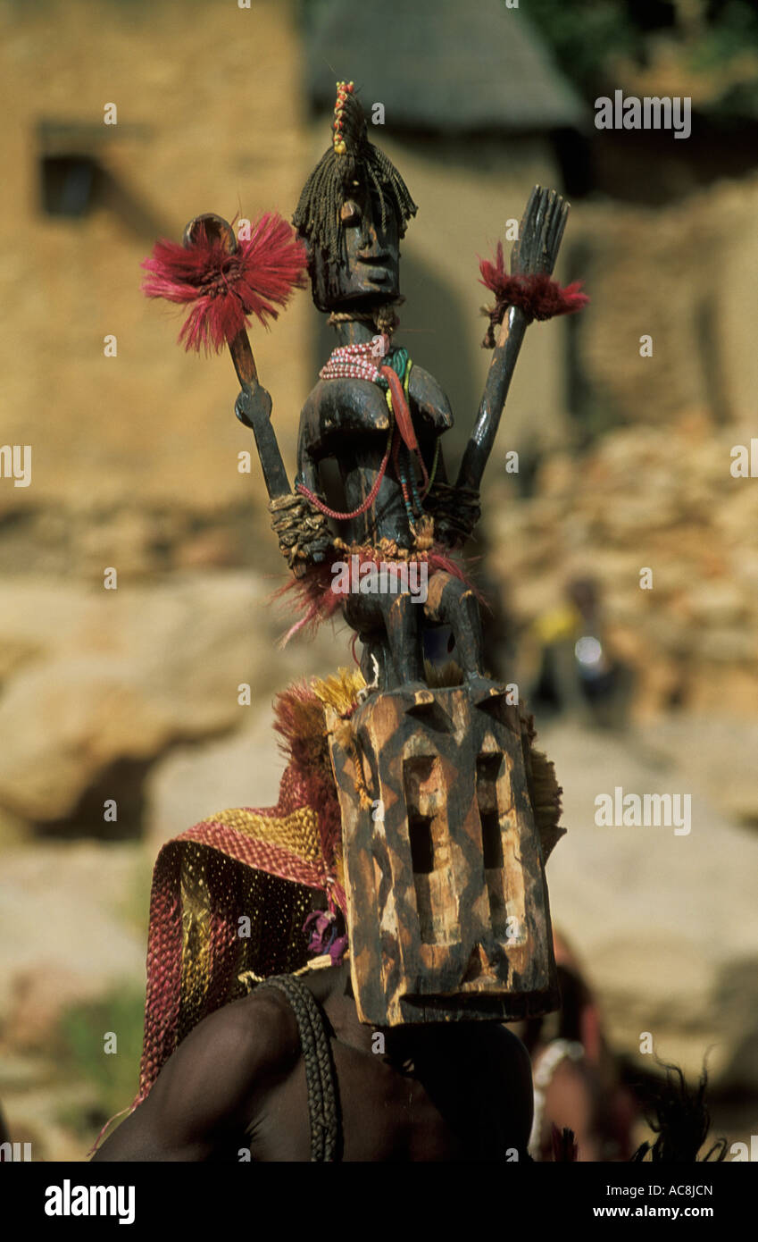 Dogon mask near Bandiagara escarpment, Dogon country Mali Stock Photo ...