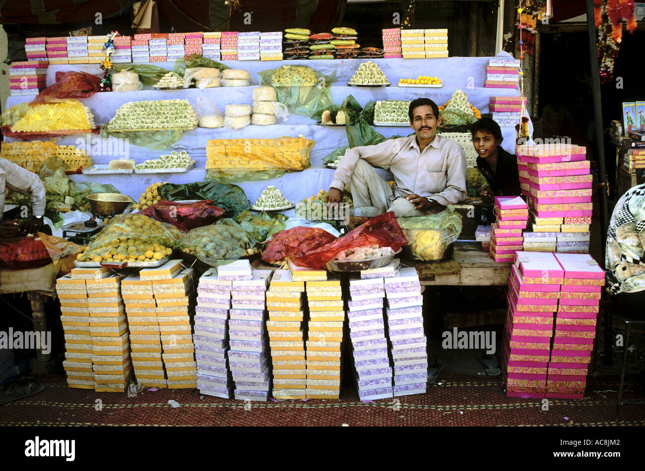 Merchant and his son attending his stall in Delhi India Stock Photo - Alamy