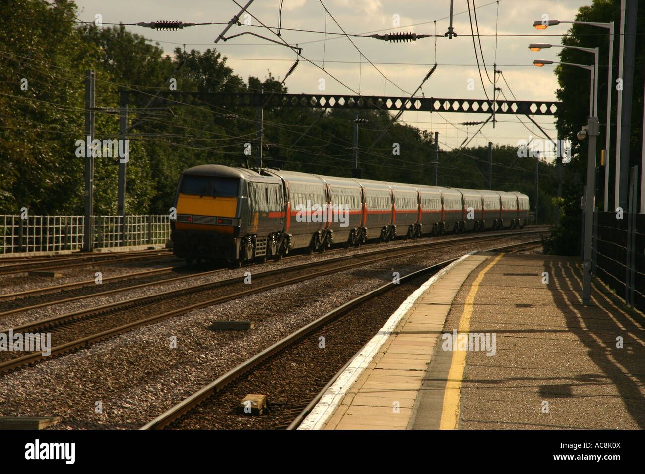 GNER Express Train Passes Through Huntindon Station at Speed Stock ...