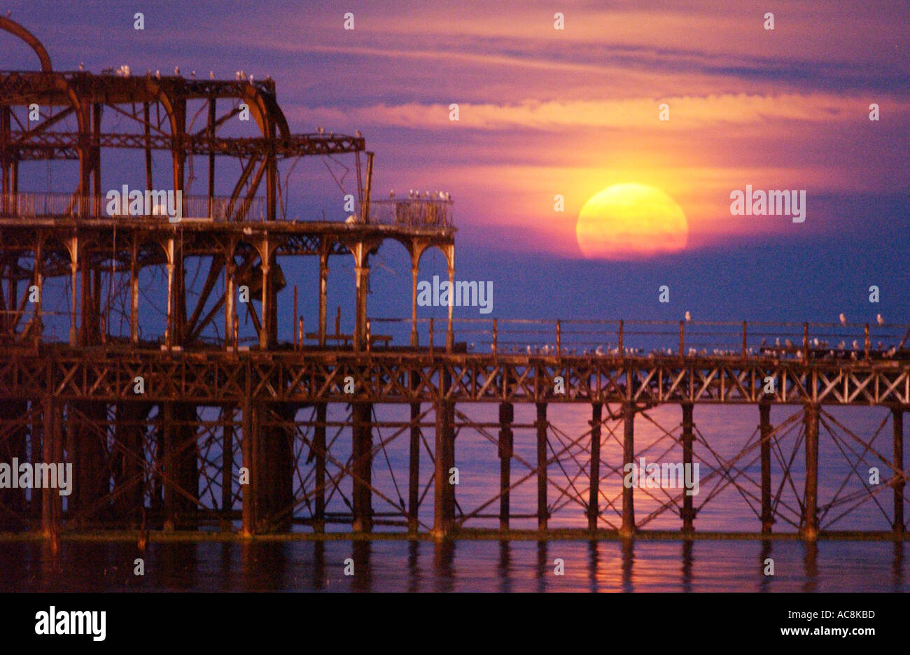 Moon Rises over Brighton seafront and ruined West Pier Stock Photo - Alamy