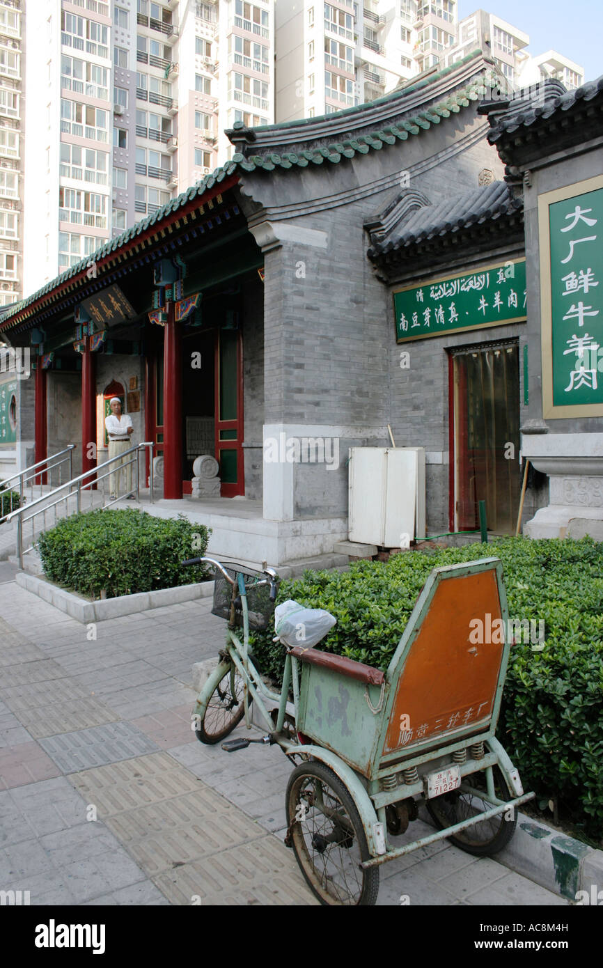 A tricycle in front of a Mosque with chinese architecture in Beijing ...