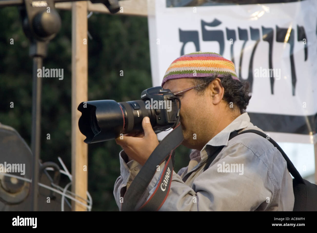 Stock Photo of AFP Photographer Menachem Kahana Shooting Canon in ...