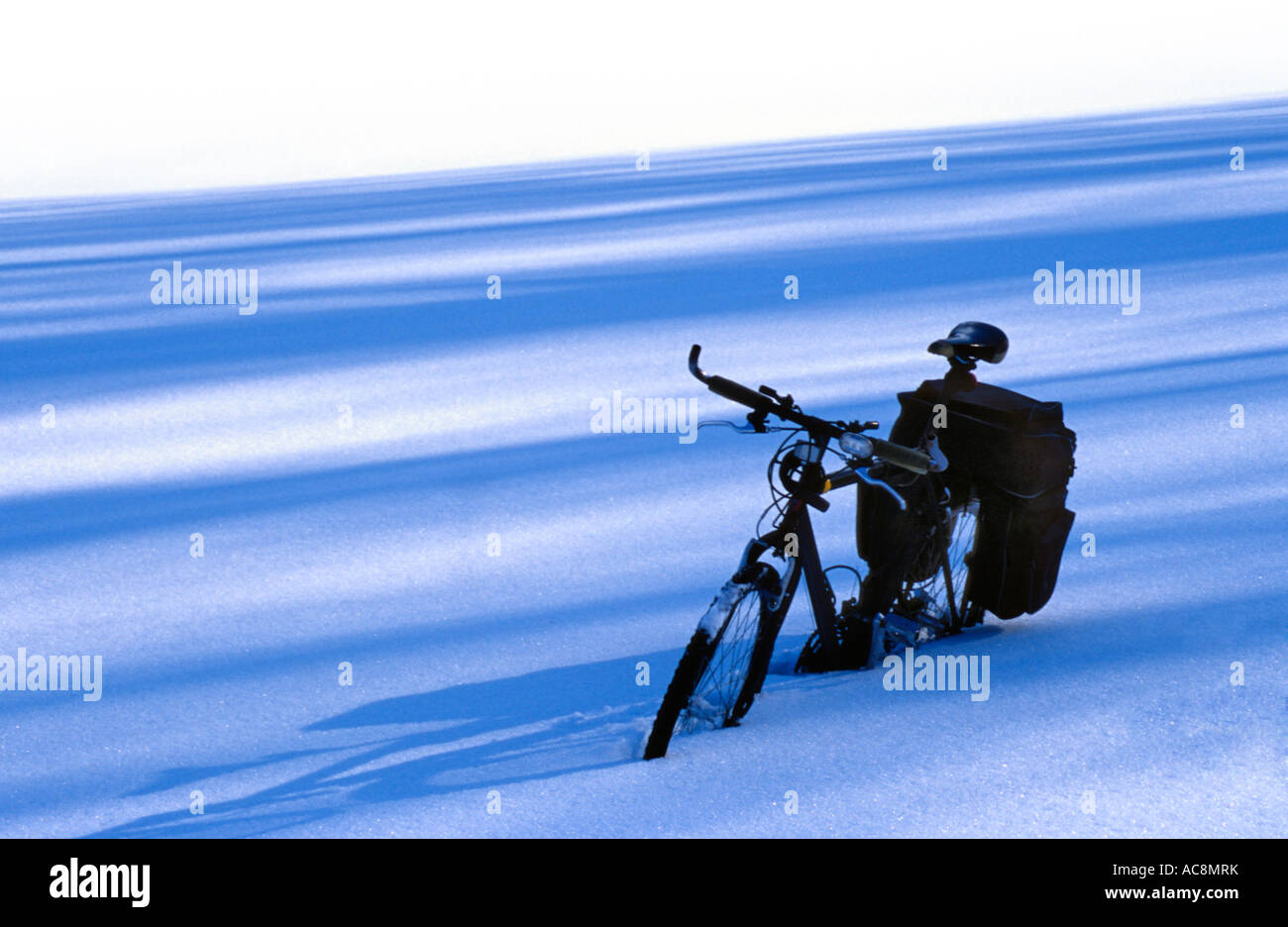 Bicycle in the snow Stock Photo - Alamy