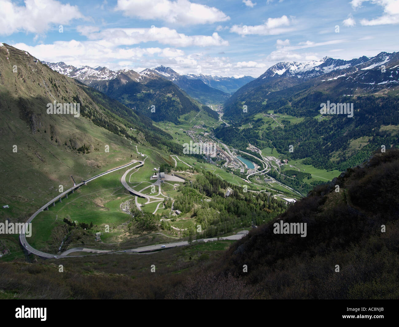 San Gotardo Saint Gotthard mountain pass road with the city of Airolo ...