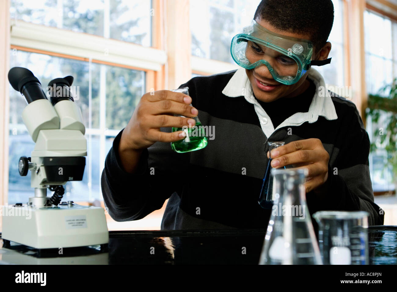 Boy looking beaker liquid hi-res stock photography and images - Alamy