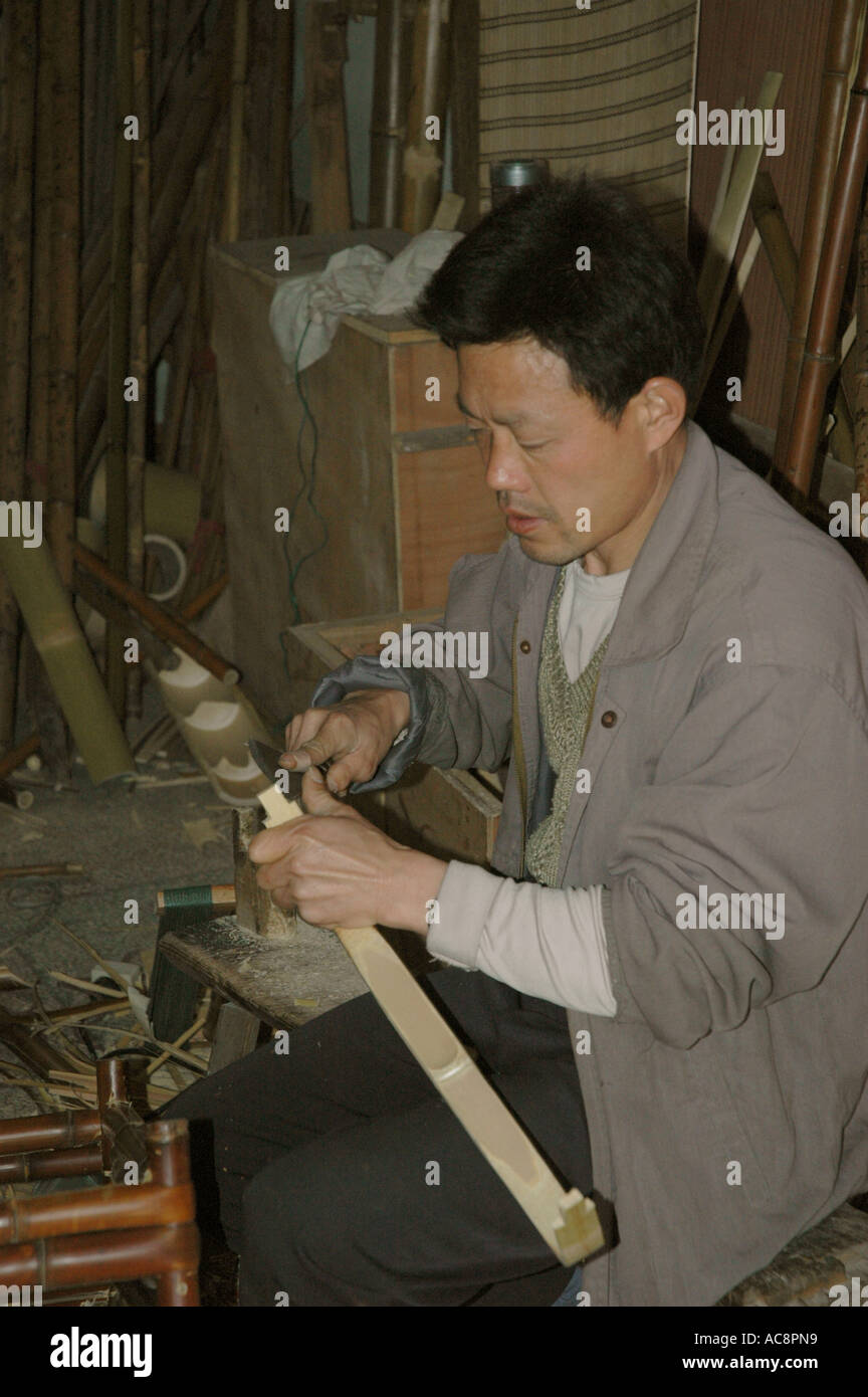 Craftsman builds bamboo furniture by hand, hunan, china Stock Photo - Alamy