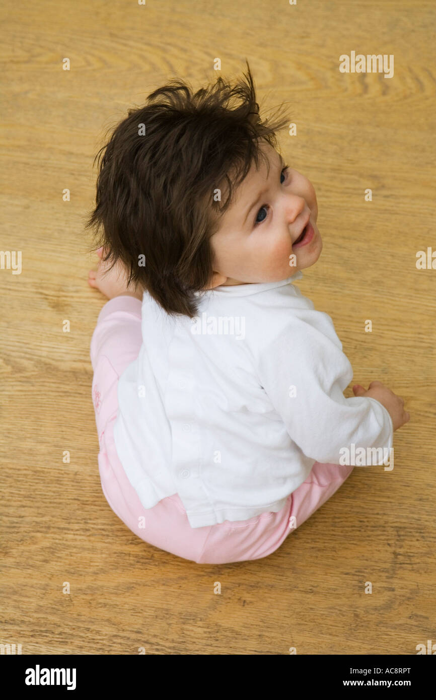 High angle view of a baby girl sitting Stock Photo - Alamy