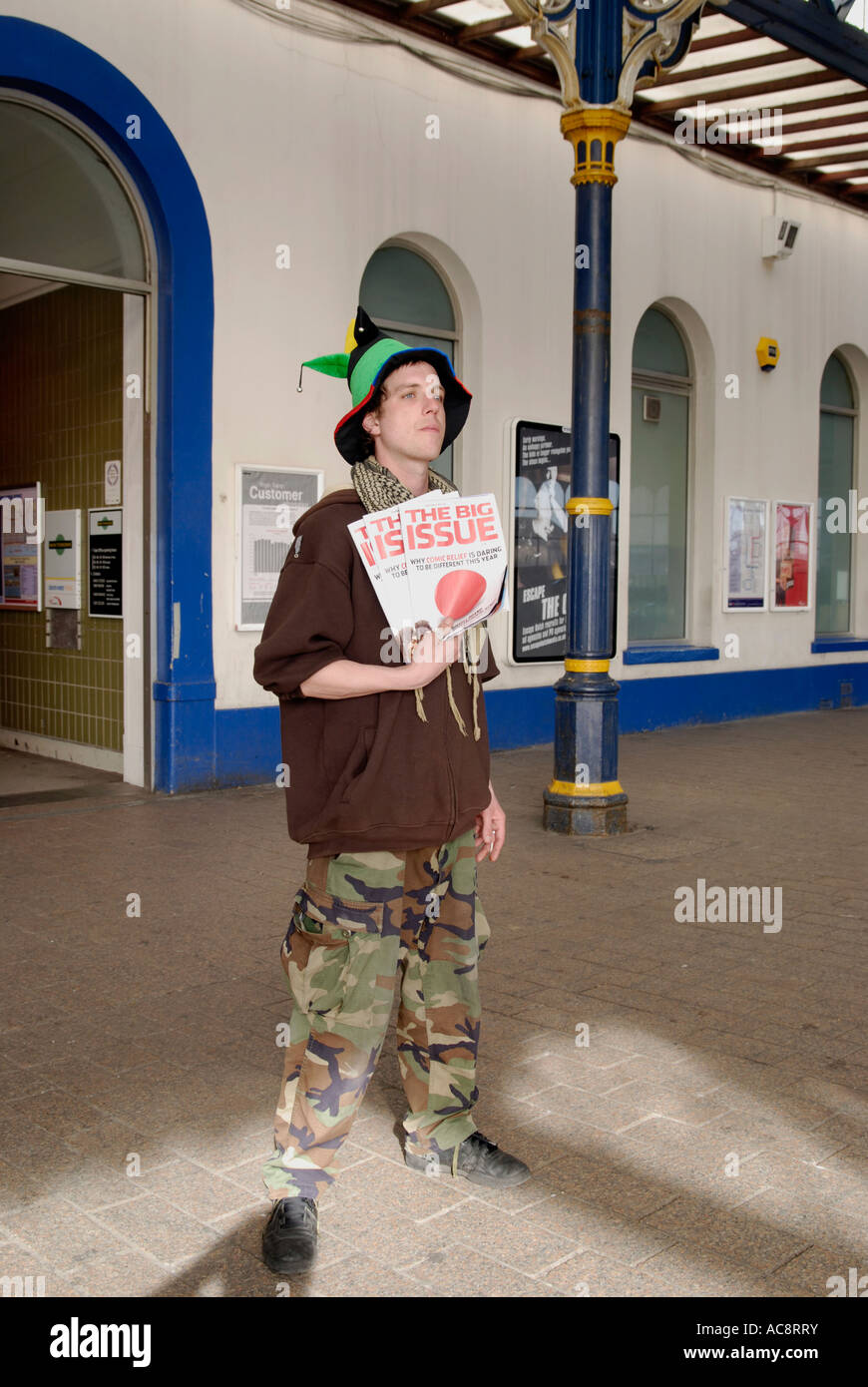 man selling big issue magazine outside Brighton railway station East ...