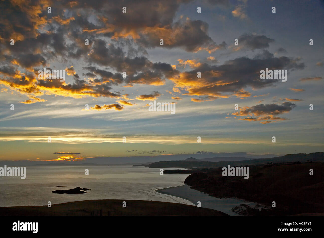 Sunset over Smaills Beach Dunedin South Island New Zealand Stock Photo ...