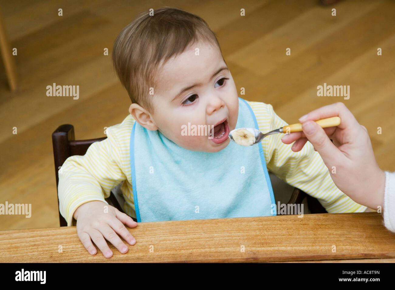 High angle view of a baby boy eating Stock Photo - Alamy